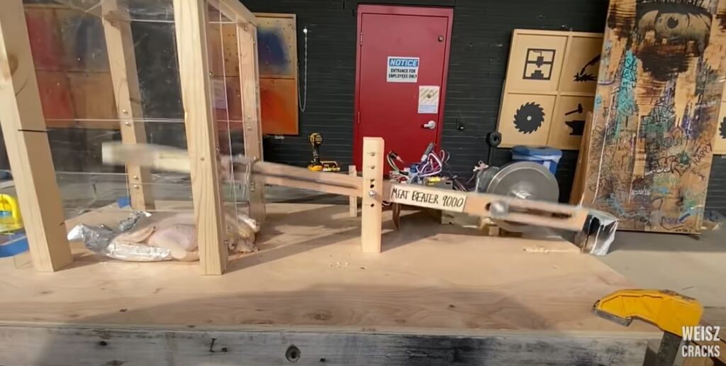 Bloke builds slapping machine to cook chicken