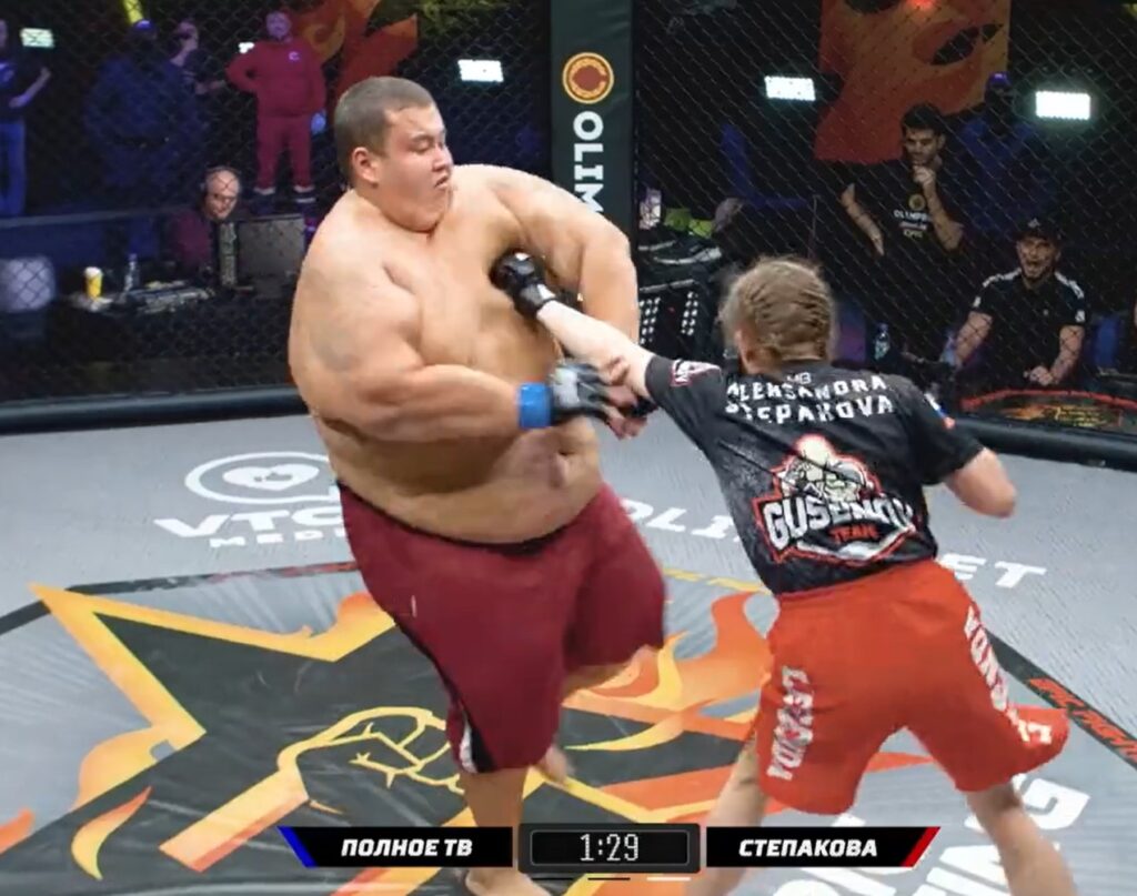 Female strawweight star fights enrmous male heavyweight in mismatch MMA ...